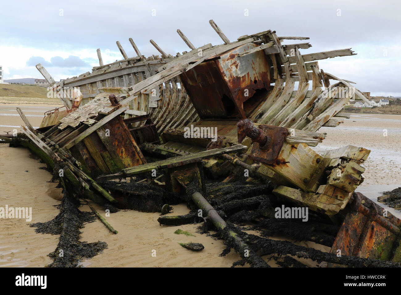 The wreck of a wooden fishing boat at Bunbeg, County Donegal, Ireland ...