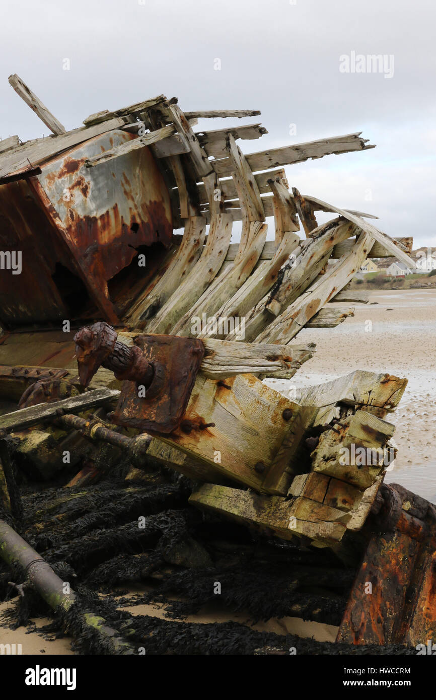 The wreck of a wooden fishing boat at Bunbeg, County Donegal, Ireland ...