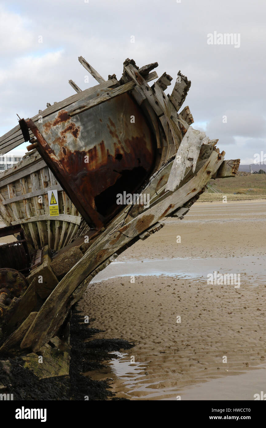 The wreck of a wooden fishing boat at Bunbeg, County Donegal, Ireland ...