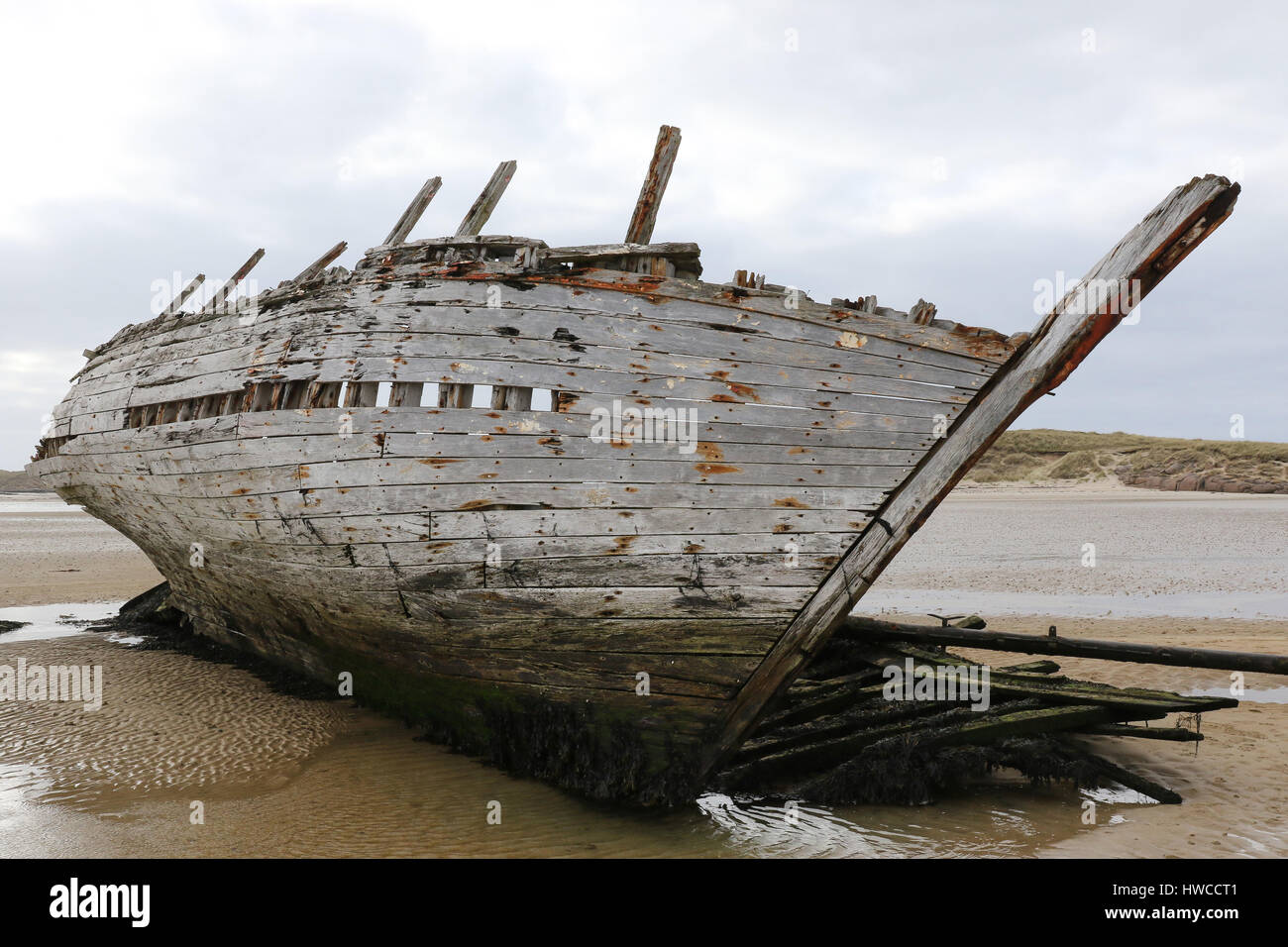 The wreck of a wooden fishing boat at Bunbeg, County Donegal, Ireland ...