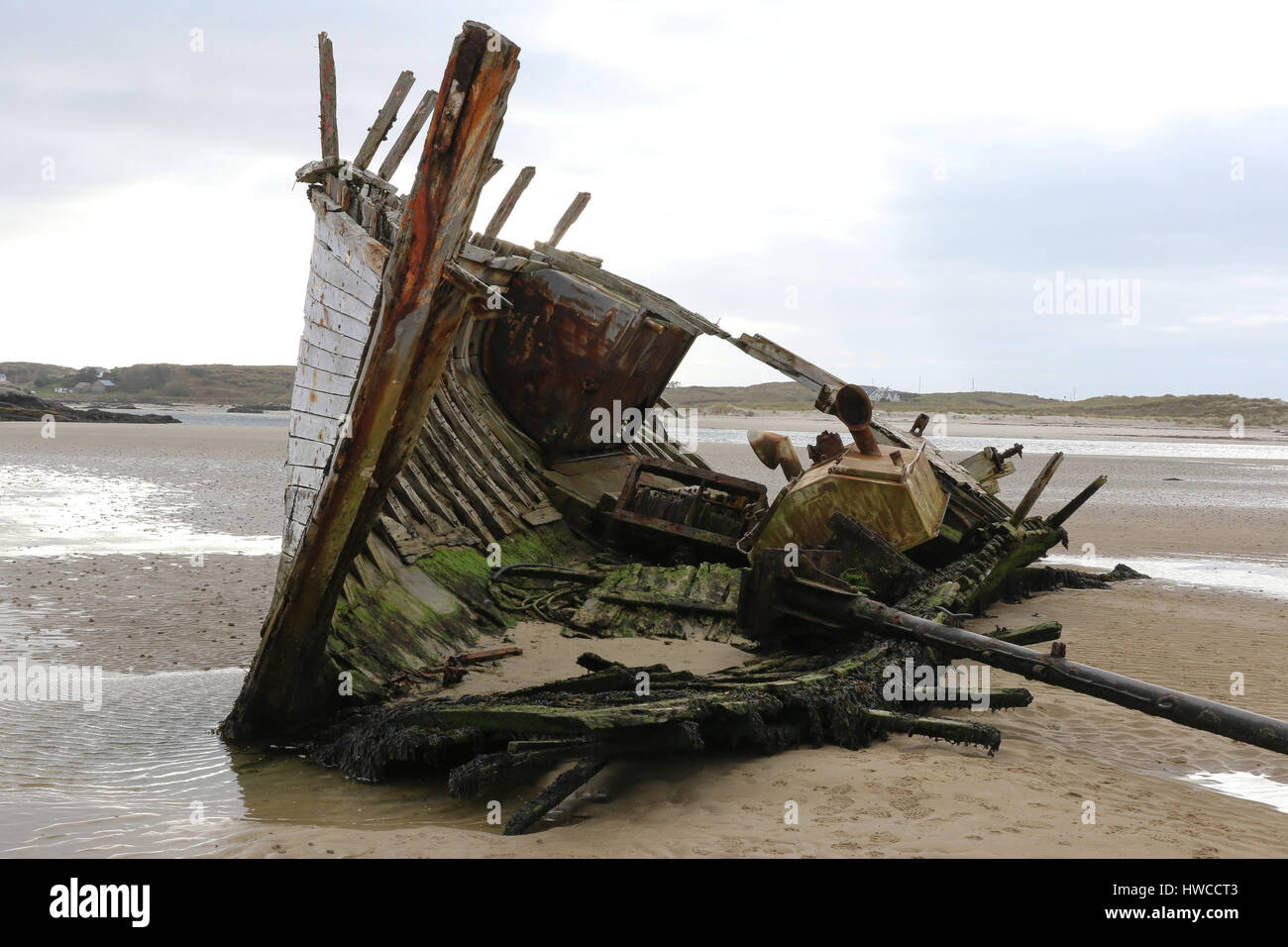 The wreck of a wooden fishing boat at Bunbeg, County Donegal, Ireland ...