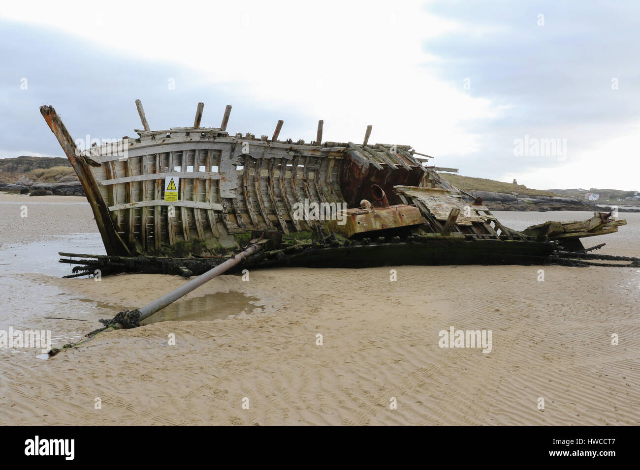 The wreck of a wooden fishing boat at Bunbeg, County Donegal, Ireland ...