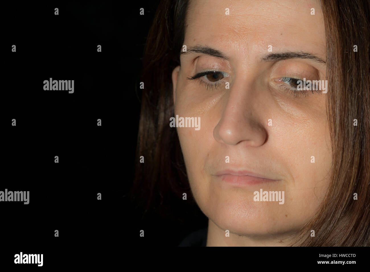 Young woman potrait isolated on black background Stock Photo - Alamy