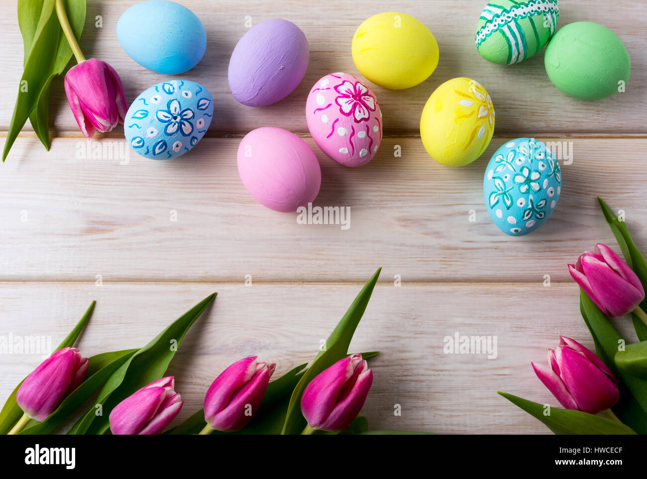 Easter background with multicolored hand painted floral decorated eggs ...