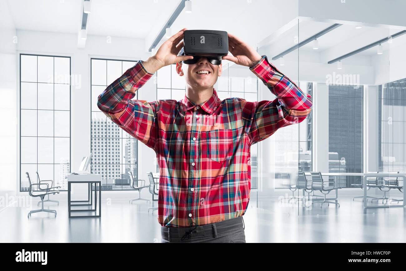 Concept of modern entertaining technologies with man wearing virtual ...