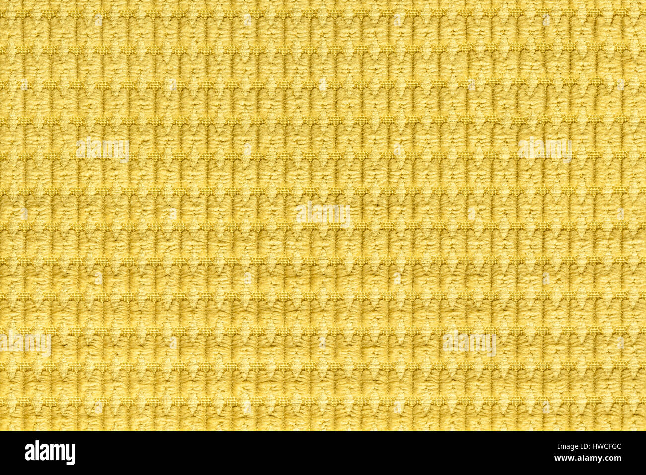 Bright yellow background from soft fleecy fabric close up. Texture of ... Bright yellow background from soft fleecy fabric close up. Texture of ...