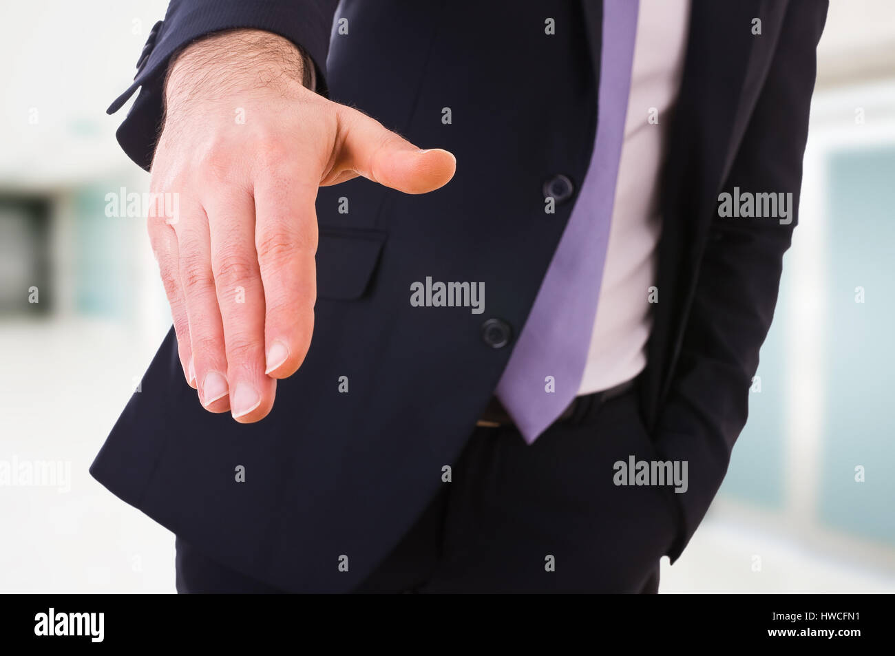 Business man giving hand Stock Photo - Alamy