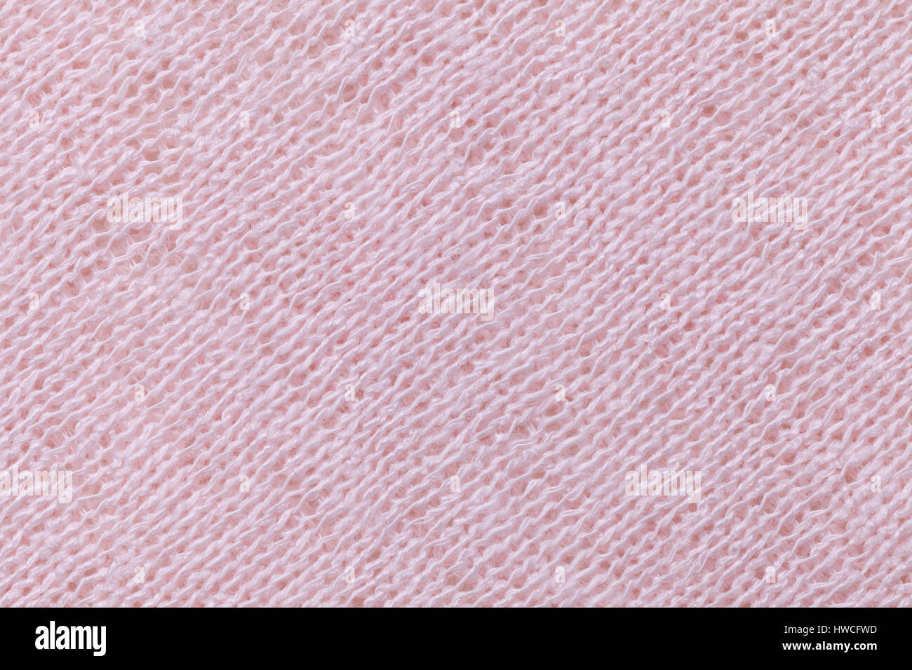 Light pink textile background closeup. Structure of the fabric macro ...