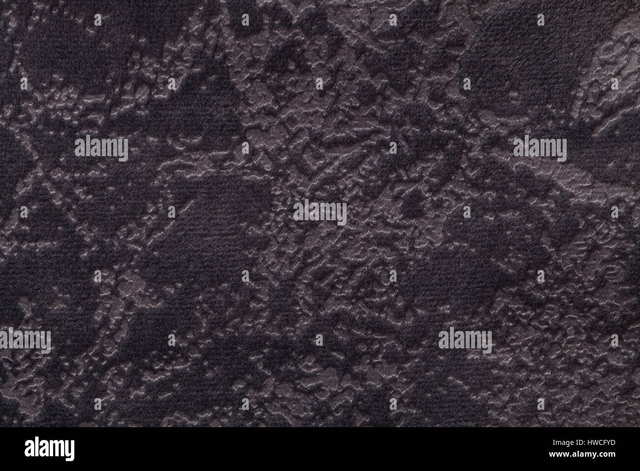 Dark brown background from a soft upholstery textile material, closeup ...