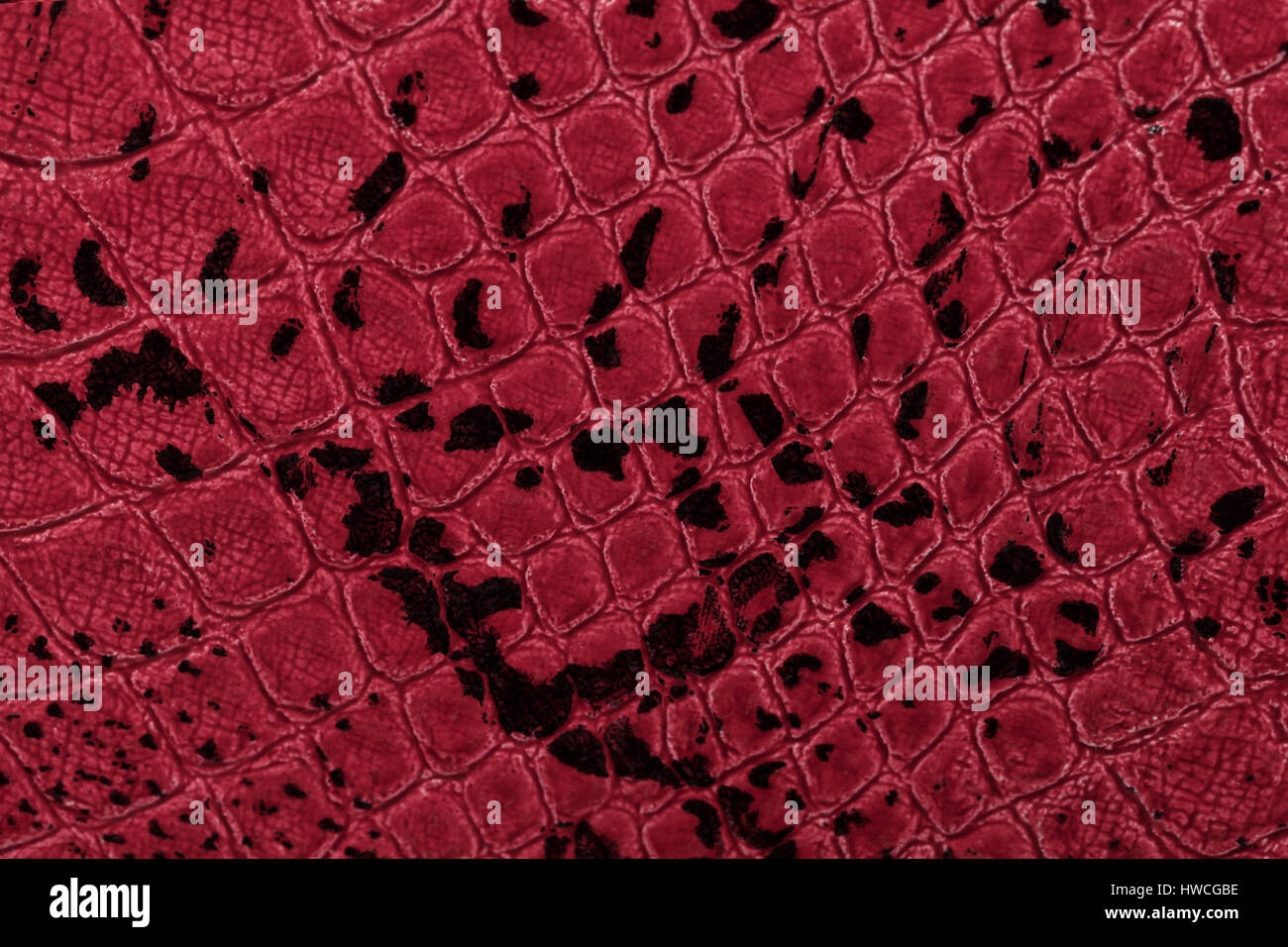 Red leather texture background. Closeup photo. Skin reptiles such as ...