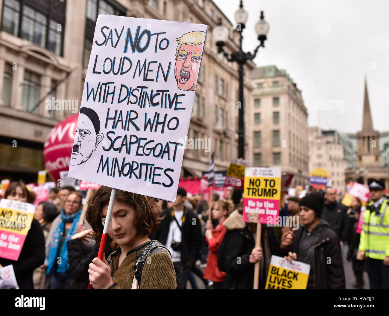 London, UK. 18th Mar, 2017. A protester at an anti-racism demonstration ...