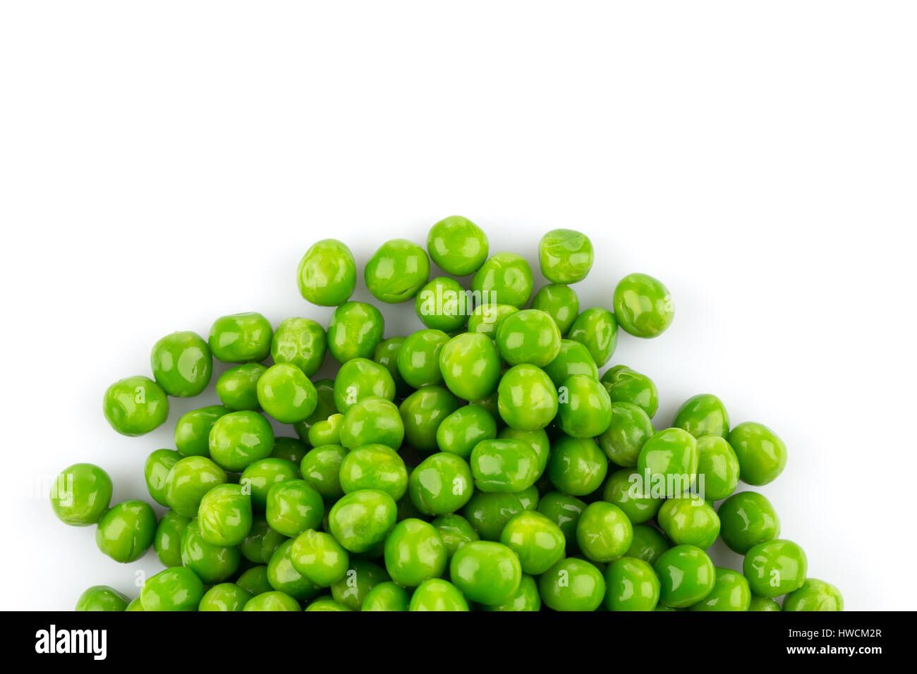 Pile of green wet pea isolated on white background Stock Photo - Alamy