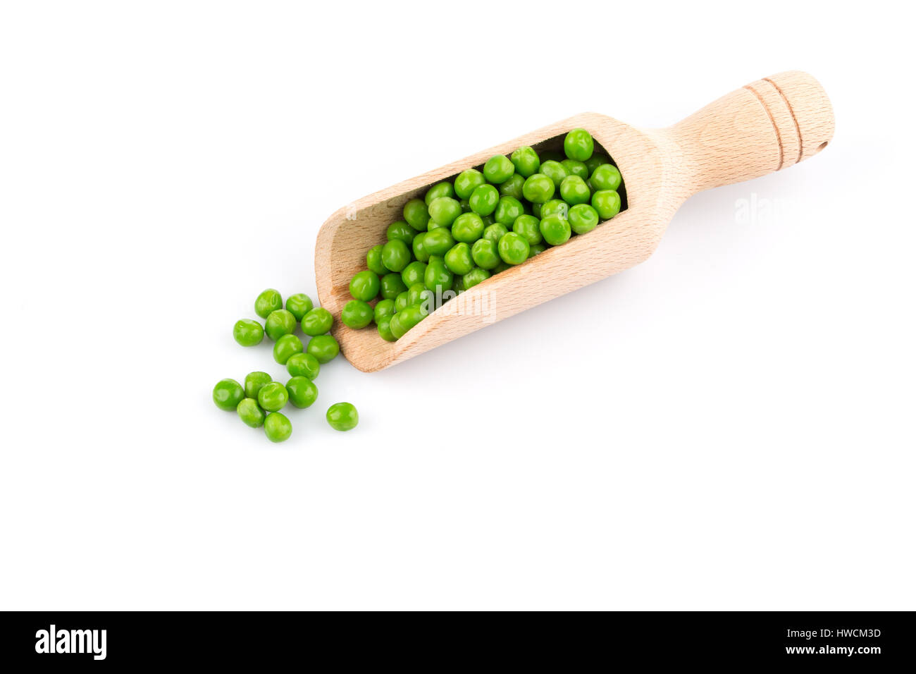 Green wet raw peas vegetable in scoop on white background Stock Photo ...