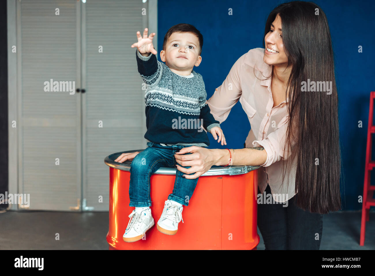 Mother and young son posing at hone Stock Photo - Alamy
