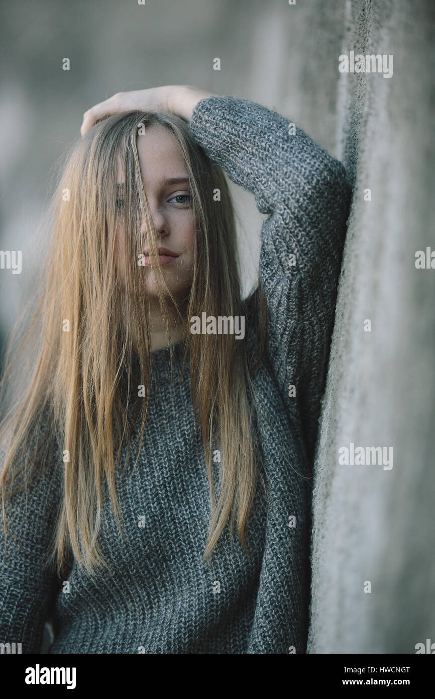 Fashion girl posing against wall Stock Photo - Alamy