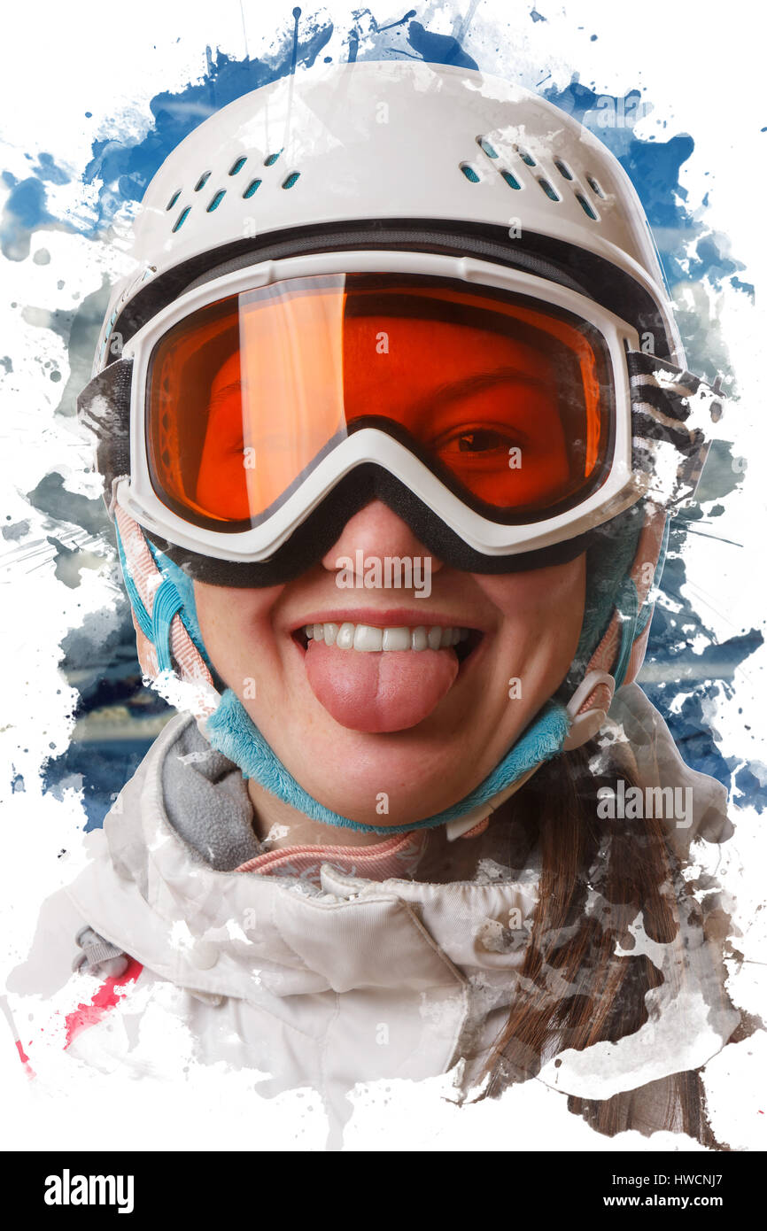 A young snowboard girl wearing a helmet and glasses put out her tongue ...