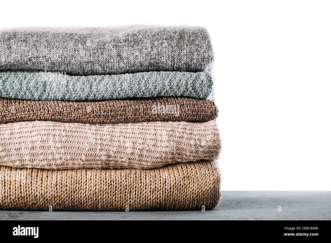 Pile knitted wool sweaters hi-res stock photography and images - Alamy