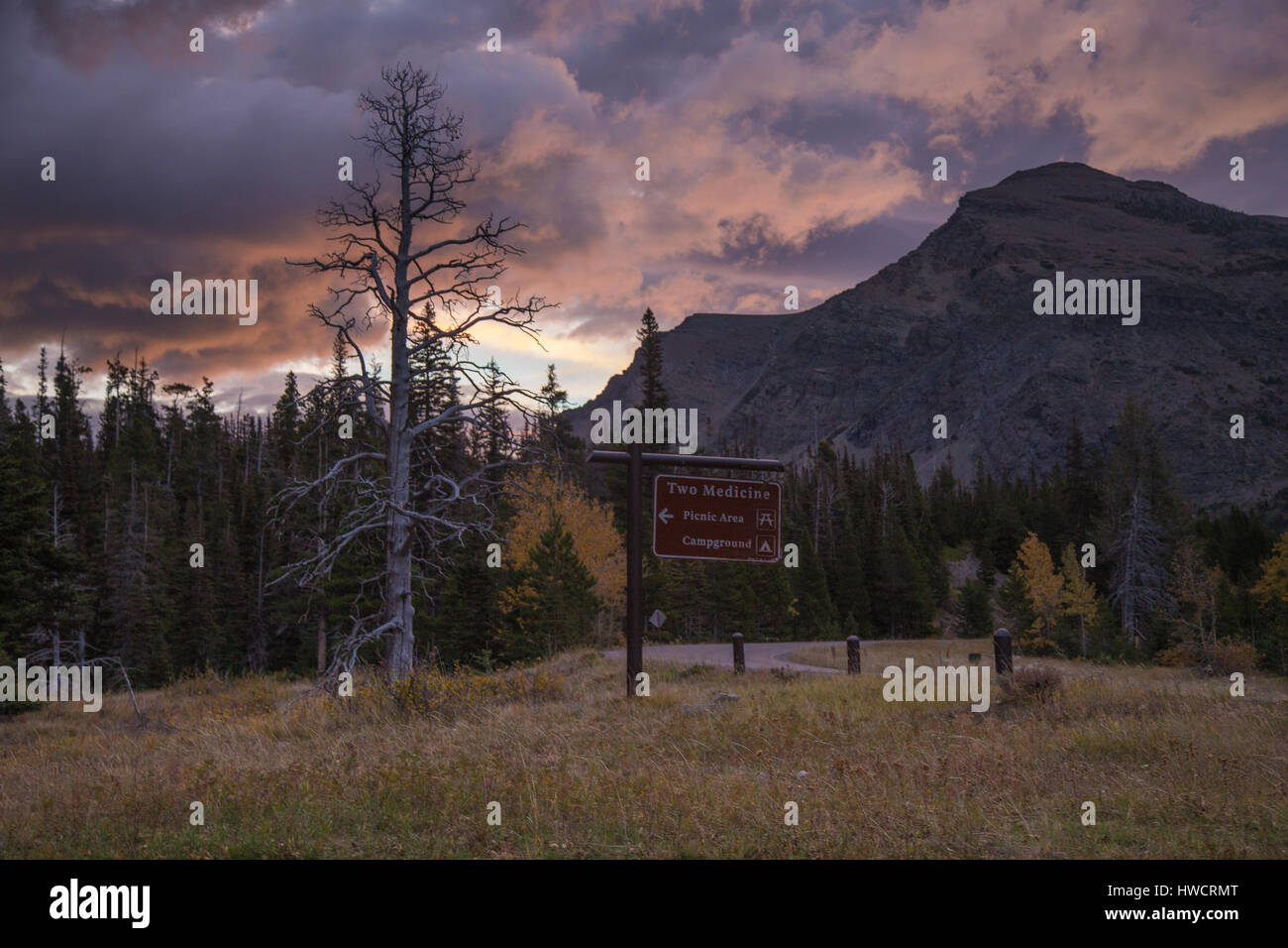 A woman stand beneath a waterfall in Montana Stock Photo - Alamy