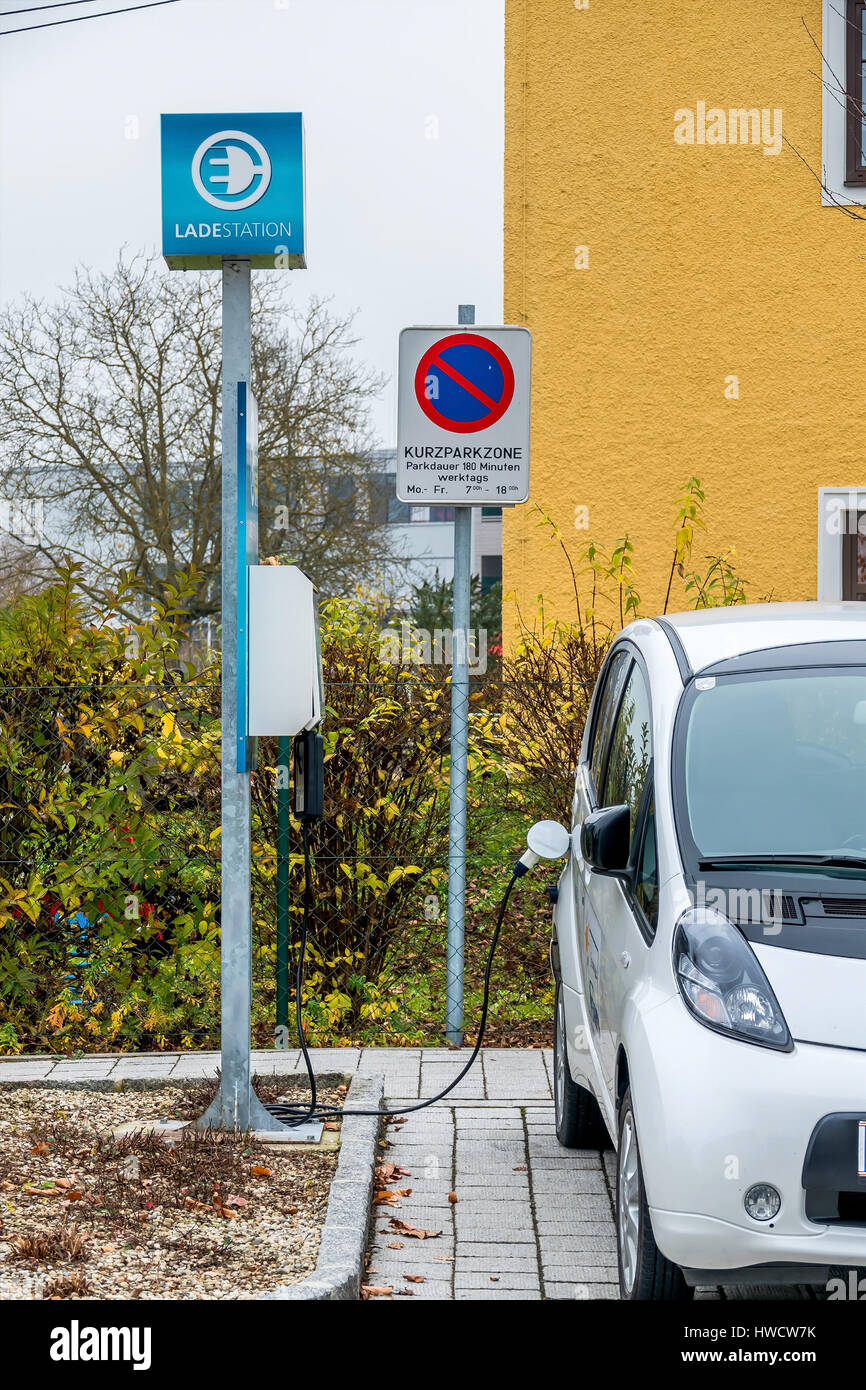 Electric car in loading station, symbol for ecology, climate protection ...