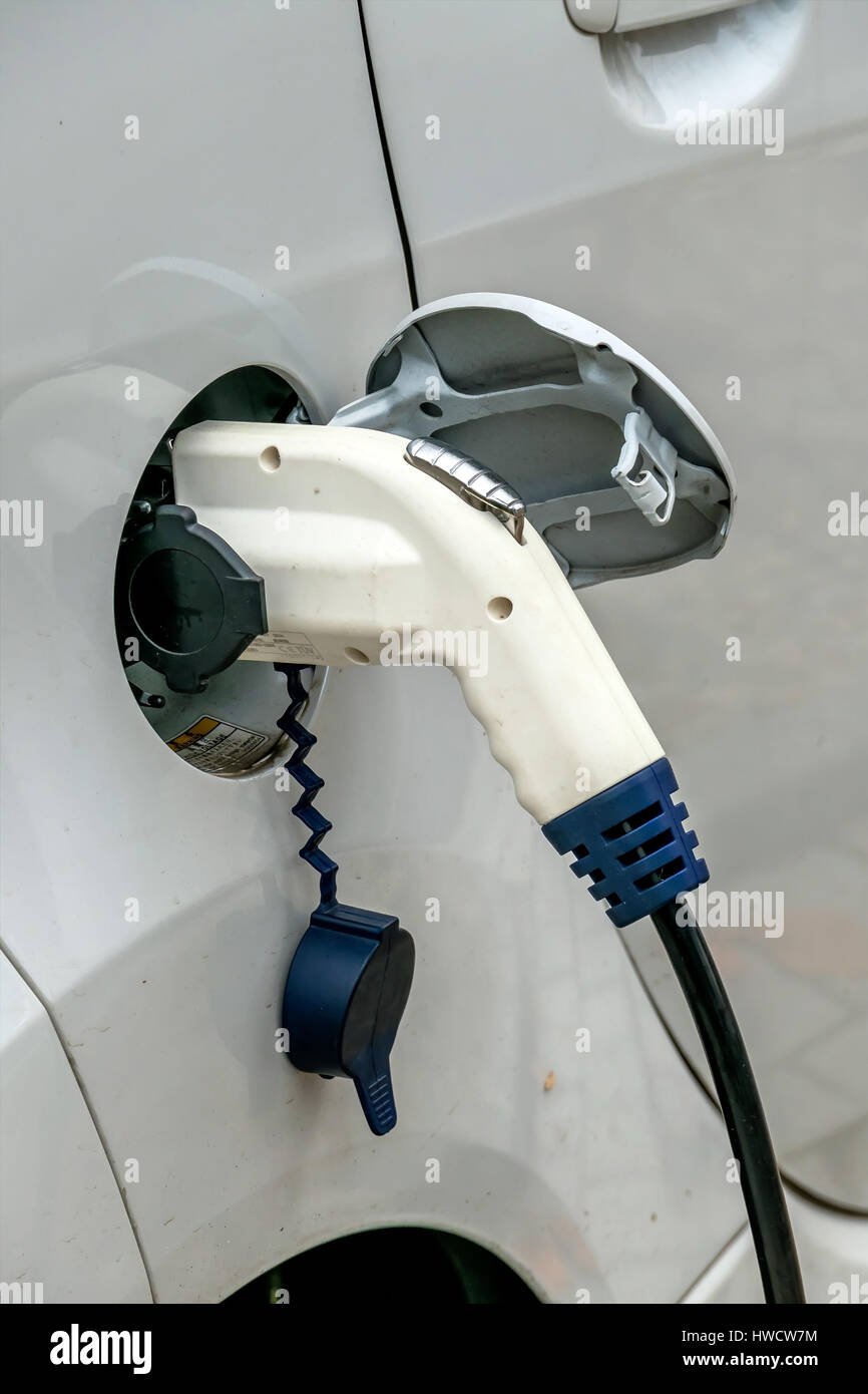 Electric car in loading station. Symbol for ecology, climate protection ...