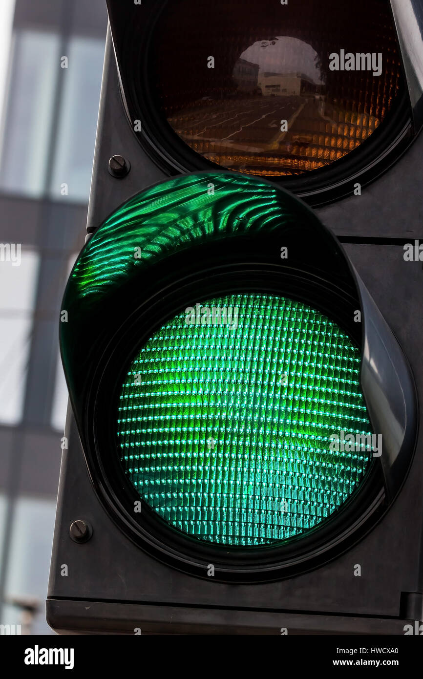 A traffic light shows green light for free journey over the crossroad ...