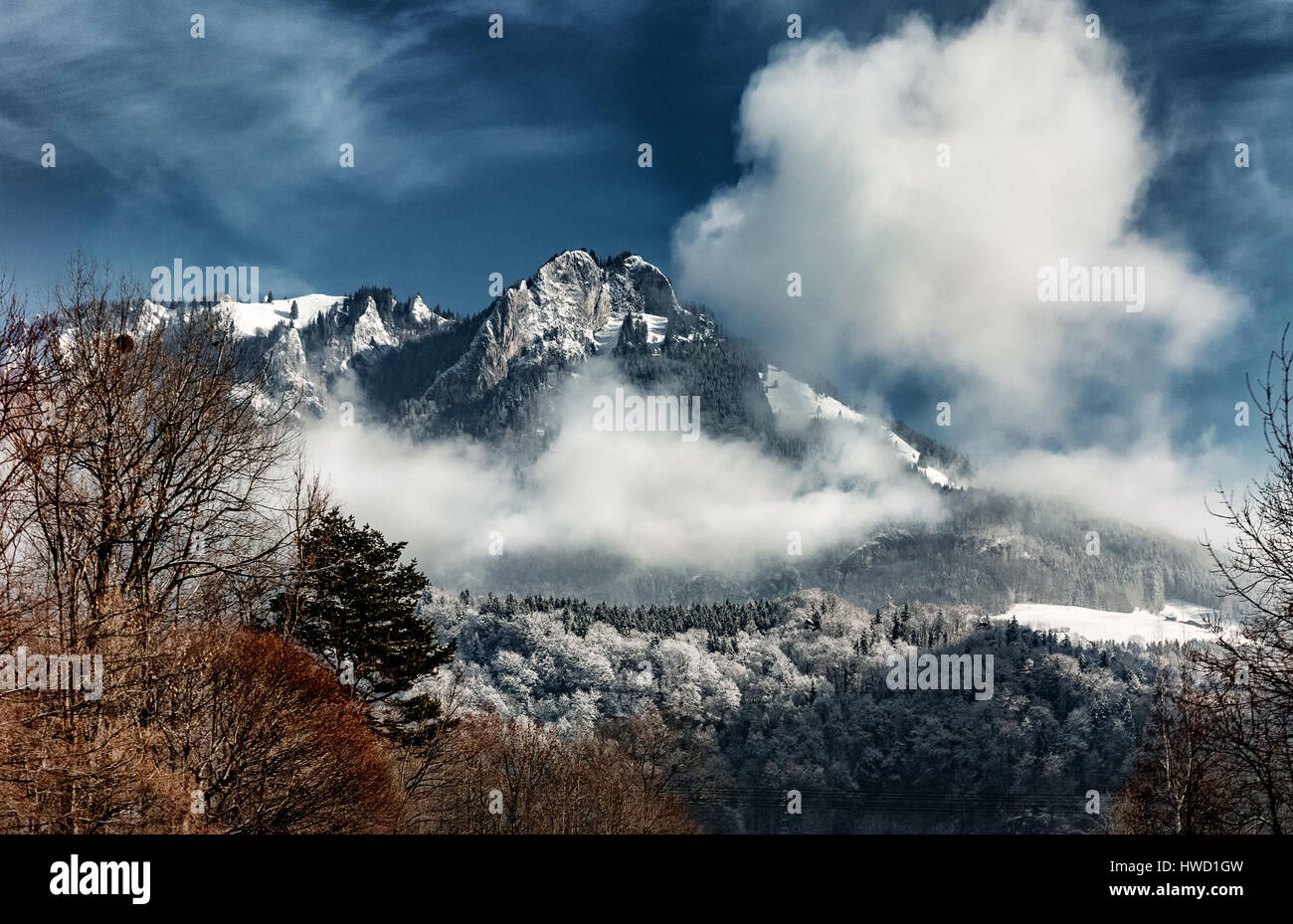 Snowy Mountains Peak with clouds Stock Photo - Alamy