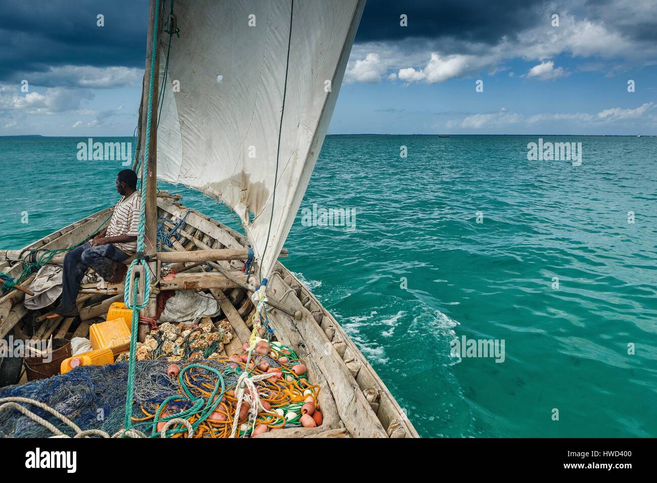 Tanzania, Zanzibar, Kendwa, boat sailing in turquoise waters Stock ...