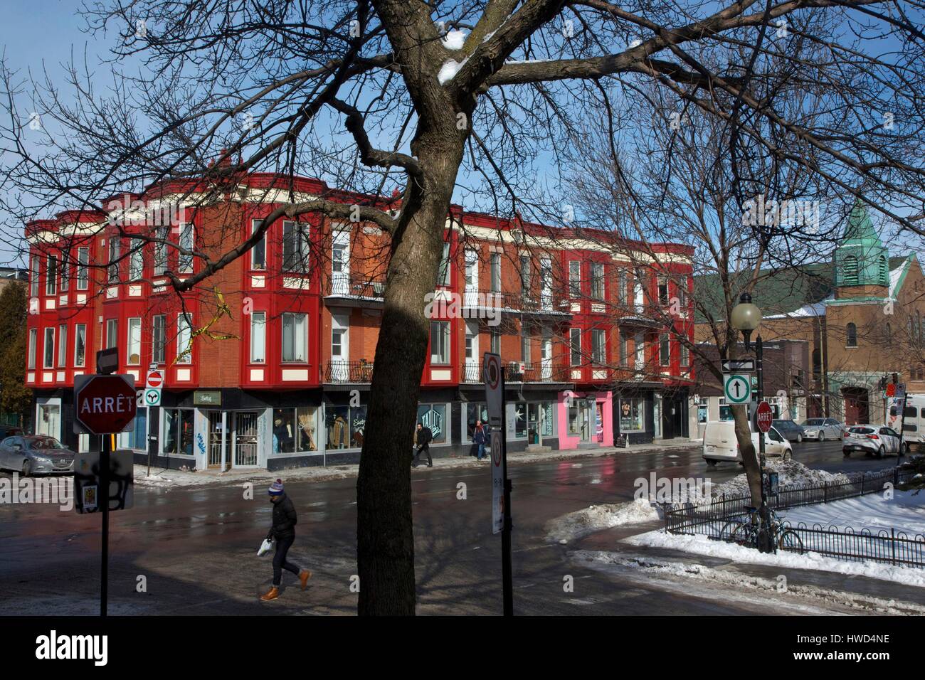 Canada, Quebec province, Montreal, building brick with red bow windows ...