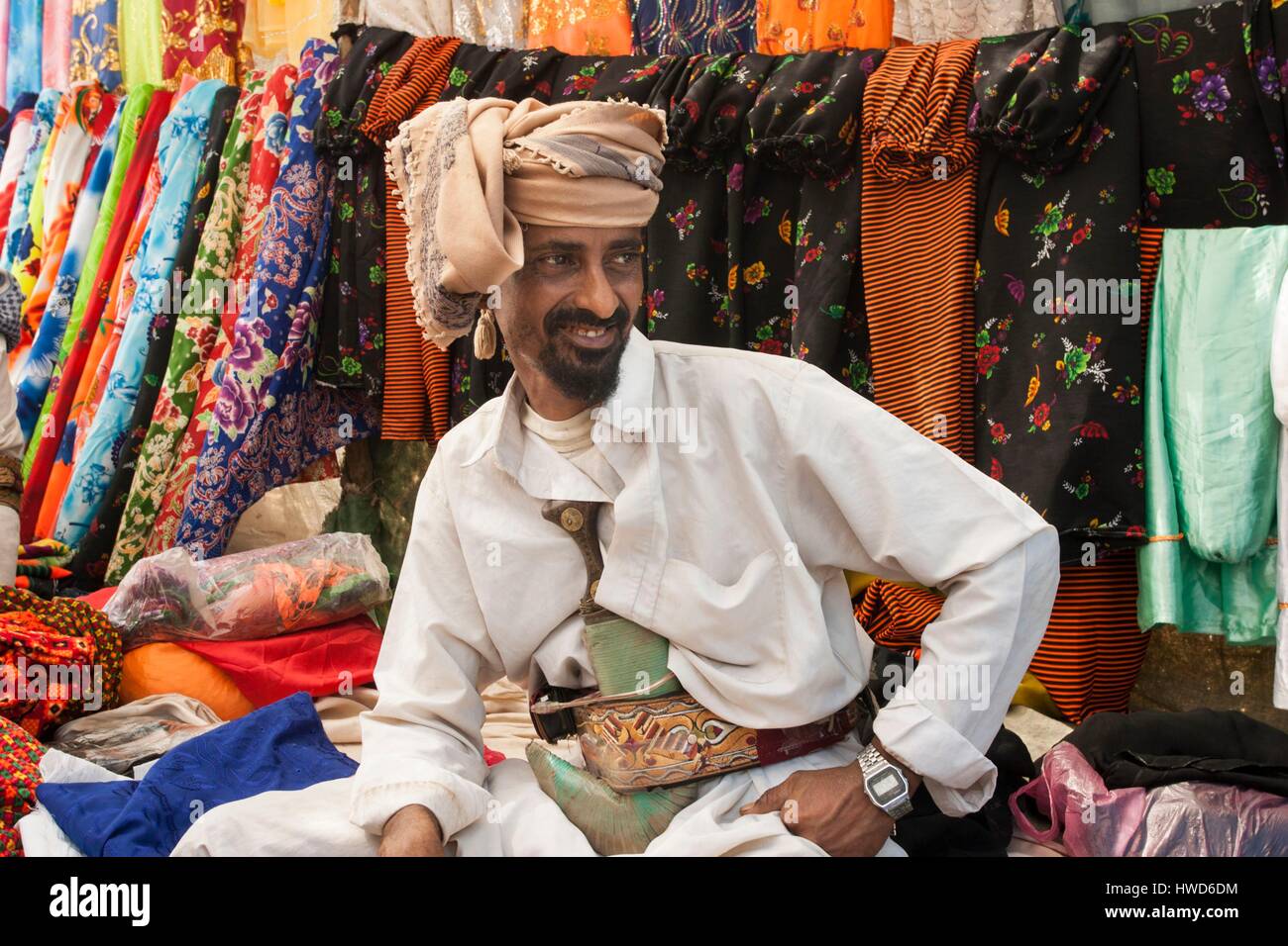 Yemen, Sanaa souk, textile seller with janbiya Stock Photo - Alamy