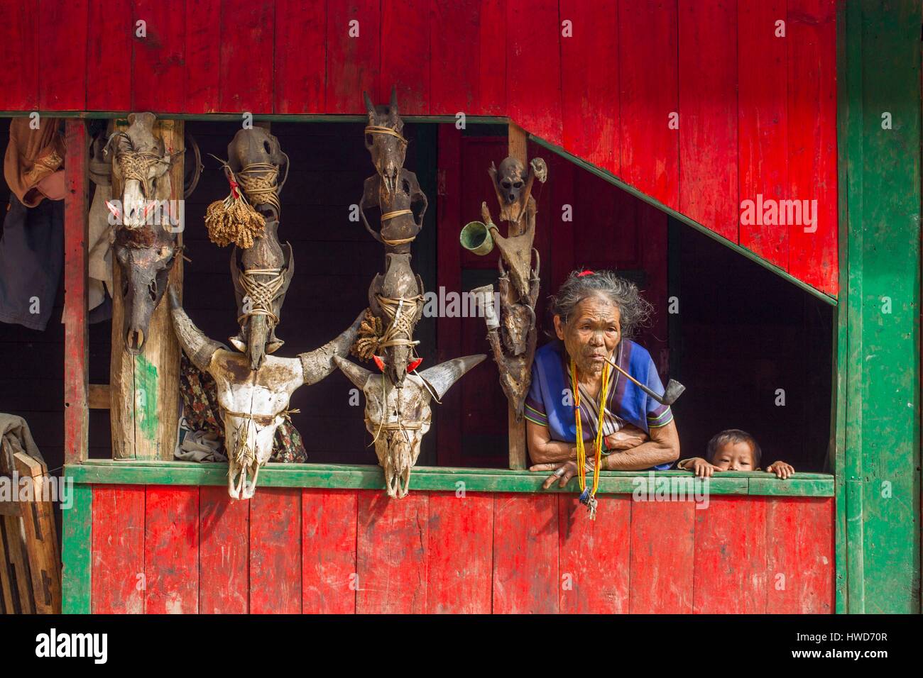 Myanmar (Burma), Chin state, Chin woman at the balcony of her house ...