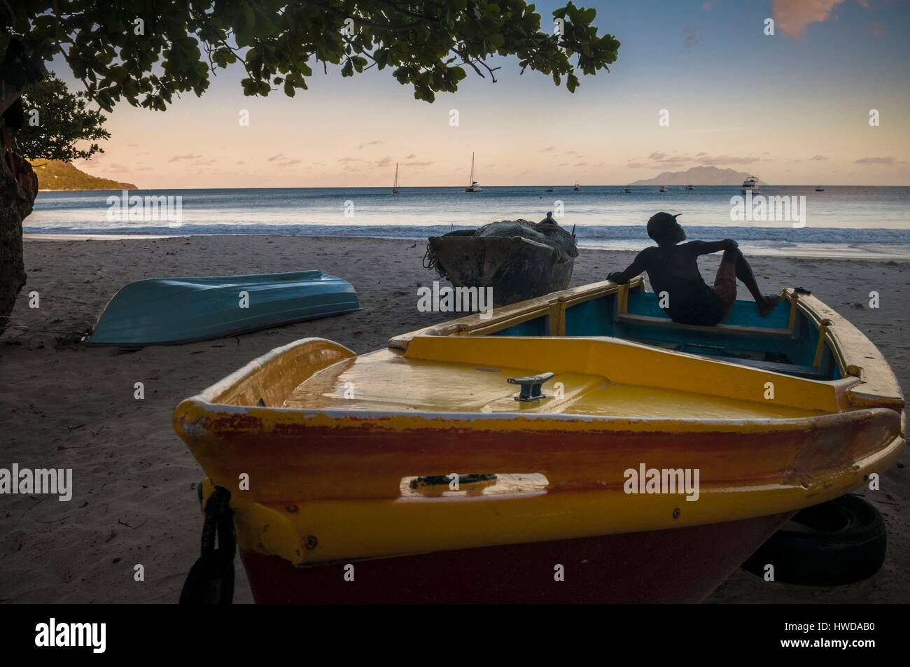 Seychelles, Mahe Island, Beau Vallon, old fisherman watching the ocean ...