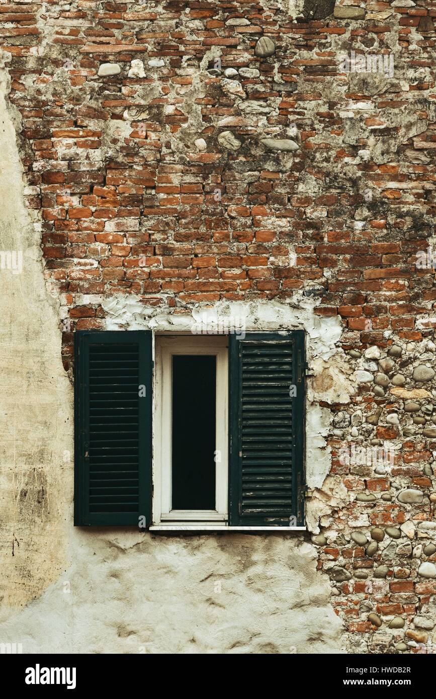 Vintage window with brick texture closeup in medieval Town Lucca in ...