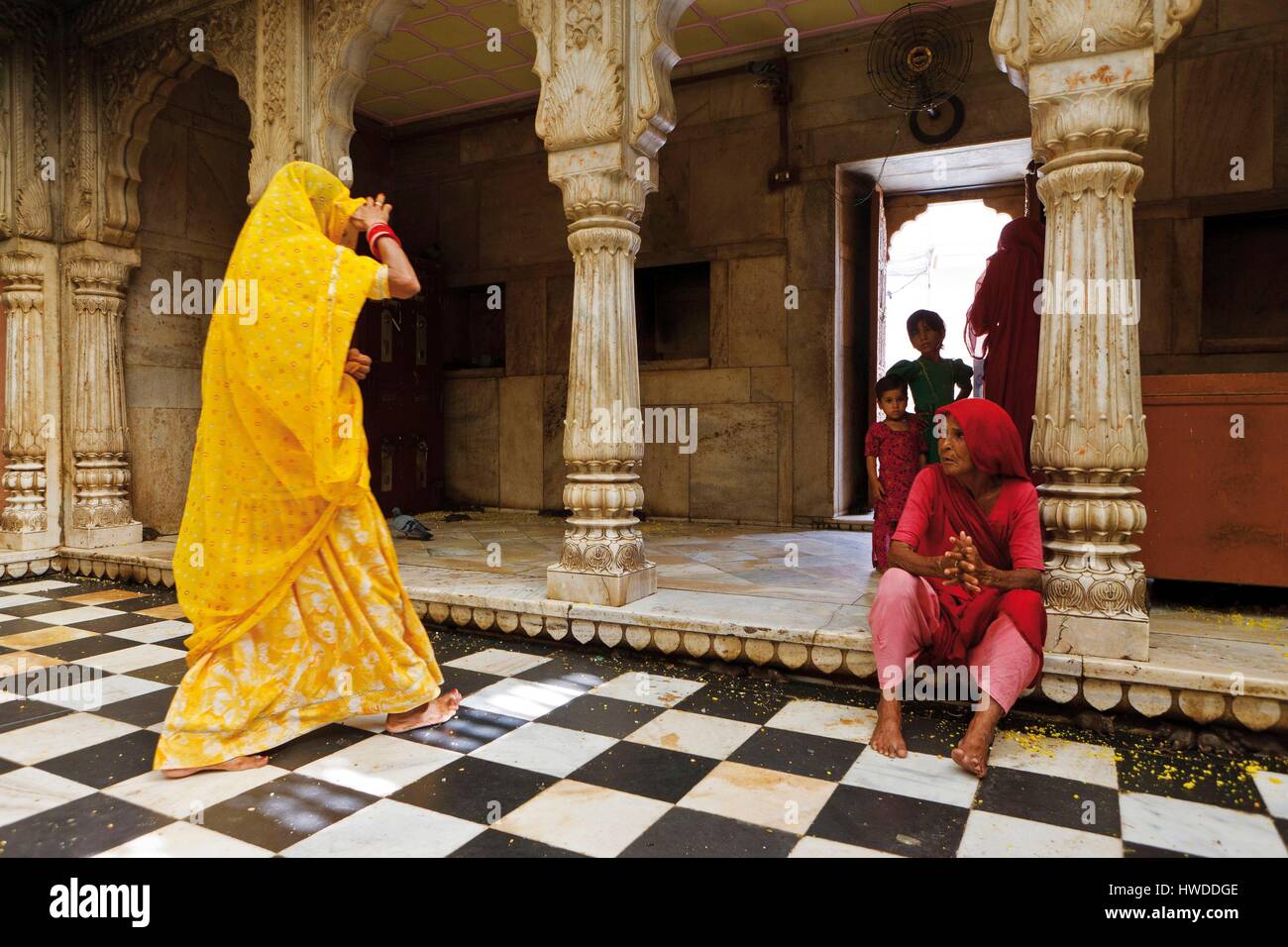 India, Rajasthan, Deshnoke, Karni Mata, women in saris in the temple ...