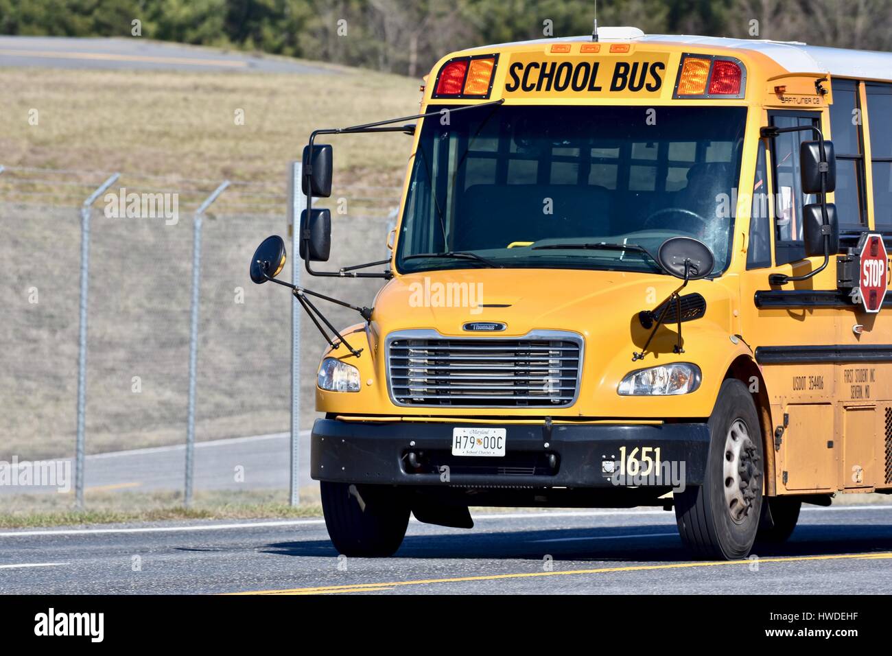School bus driving on road hi-res stock photography and images - Alamy