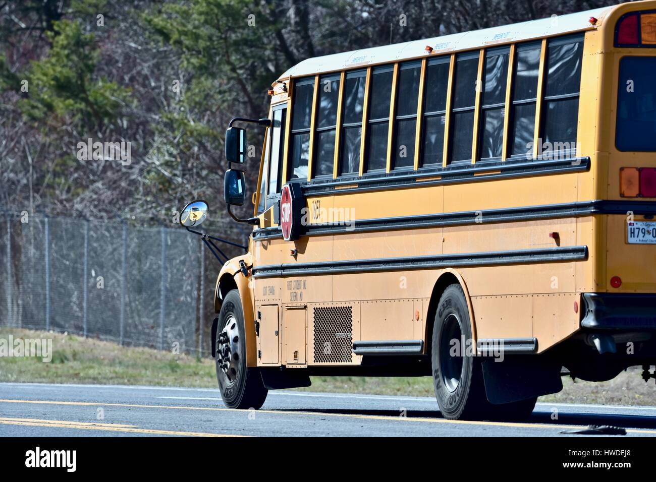 School bus driving on road hi-res stock photography and images - Alamy