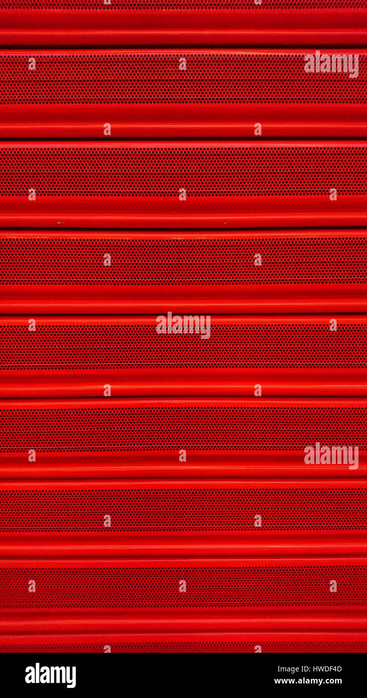 Texture of red metallic rolling shutter door of garage, warehouse ...