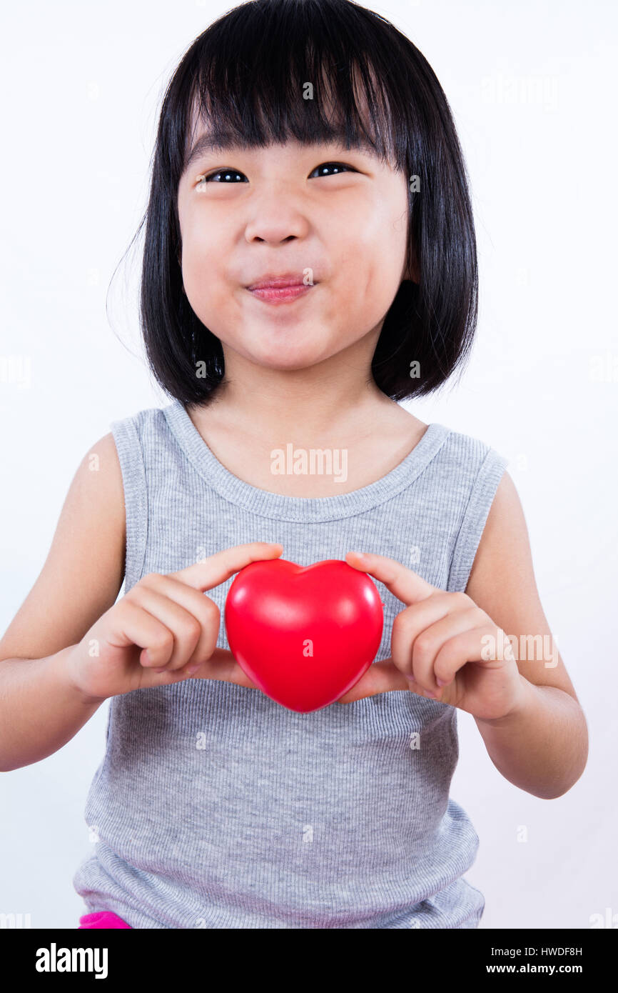 Asian Little Chinese Girl Holding Red Heart in isolated White ...