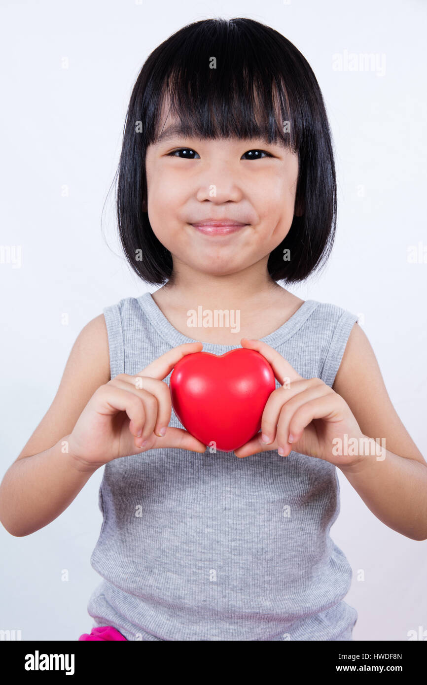 Asian Little Chinese Girl Holding Red Heart in isolated White ...
