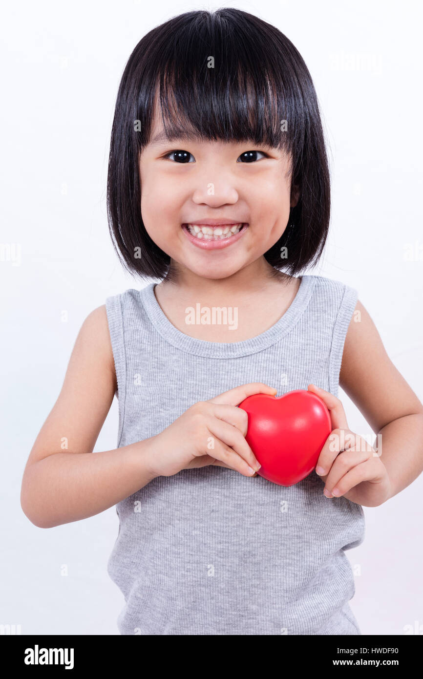 Asian Little Chinese Girl Holding Red Heart in isolated White ...