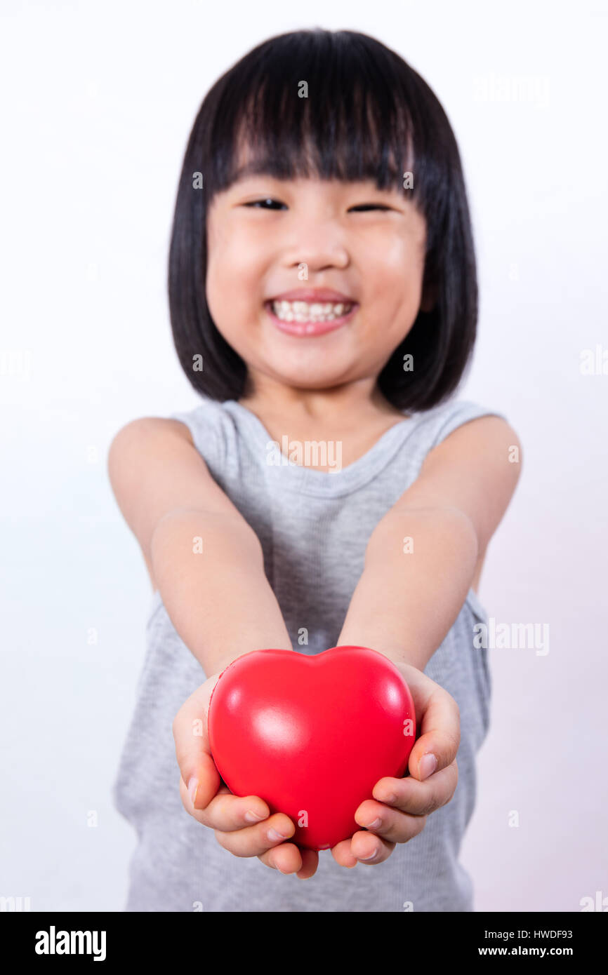 Asian Little Chinese Girl Holding Red Heart in isolated White ...
