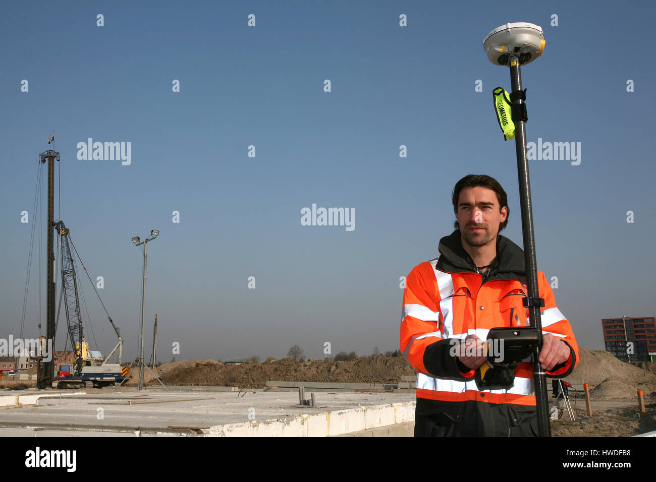 surveyor at work, measuring distance and altitudes Stock Photo - Alamy