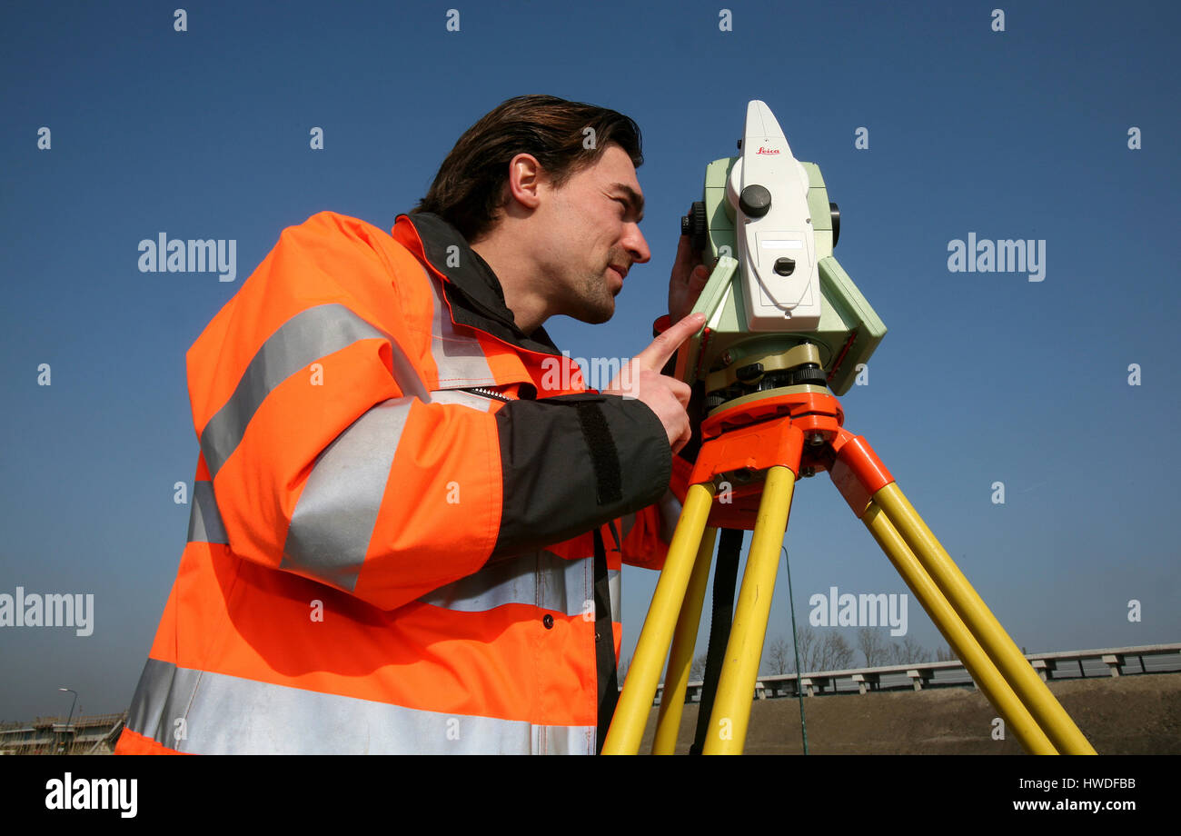 surveyor at work, measuring distance and altitudes Stock Photo - Alamy