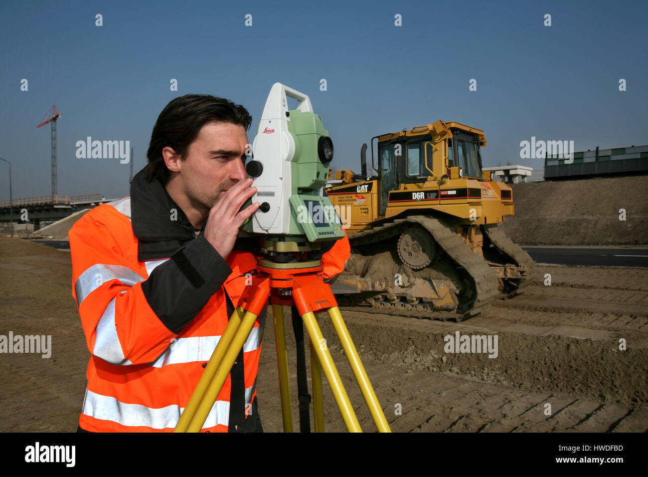 surveyor at work, measuring distance and altitudes Stock Photo - Alamy