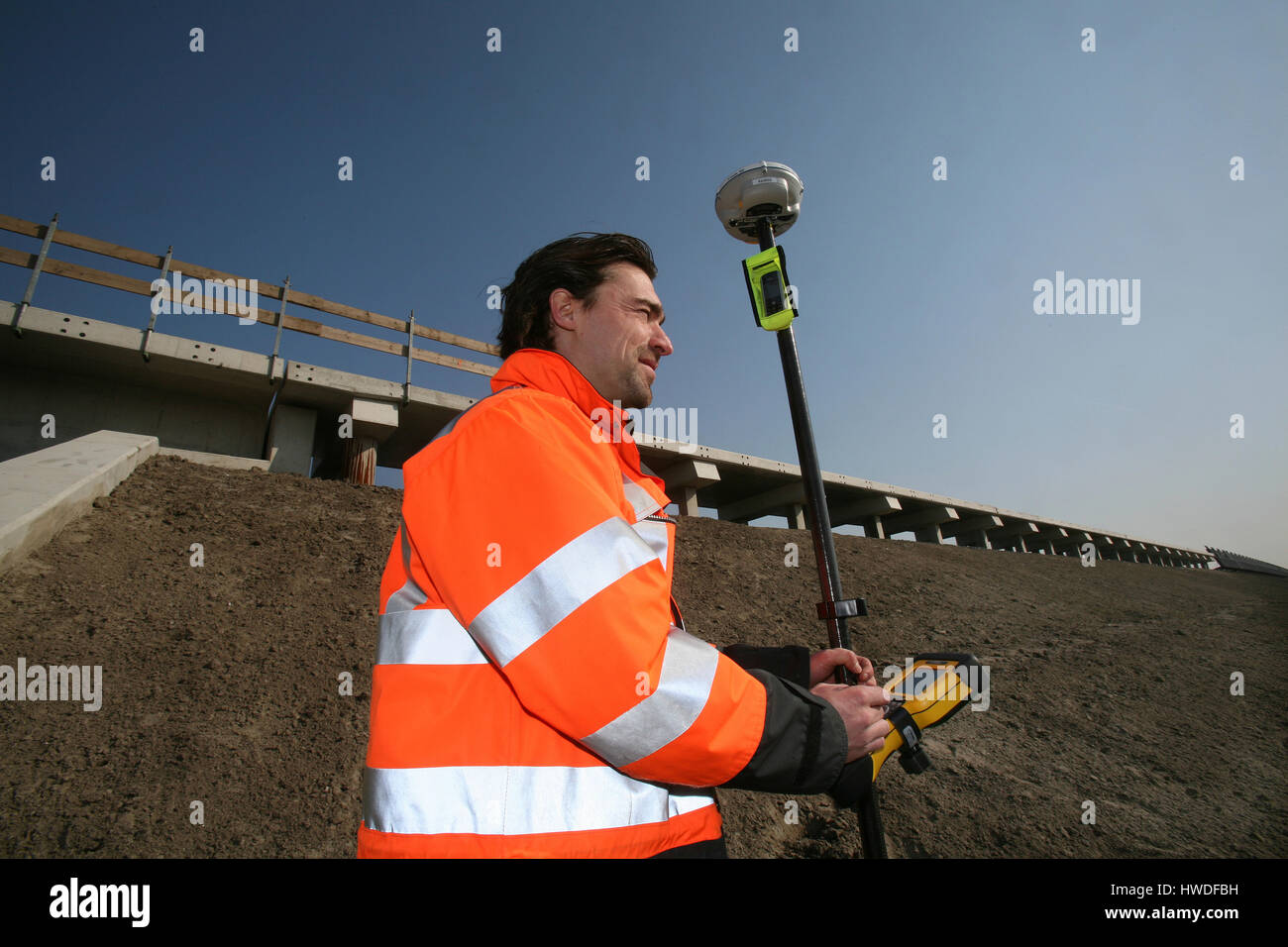 surveyor at work, measuring distance and altitudes Stock Photo - Alamy