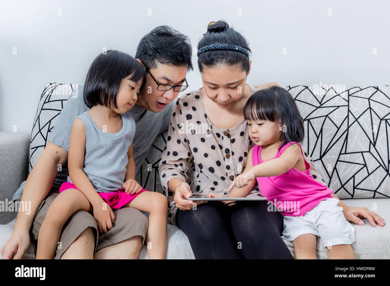 Happy Asian Chinese Family Playing with Digital Tablet Together at Home ...