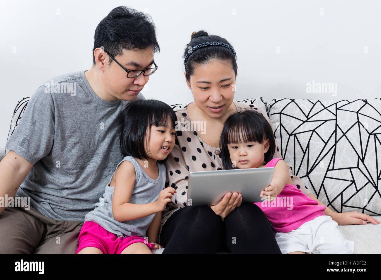 Happy Asian Chinese Family Playing with Digital Tablet Together at Home ...