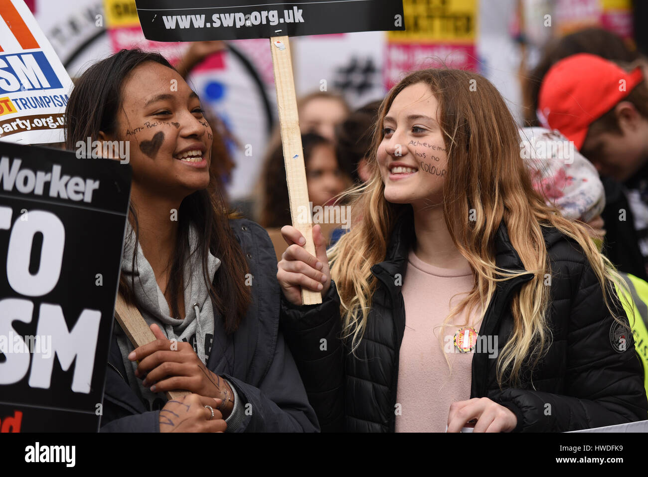 Black and Caucasian girls, friends at anti racism demonstration in ...