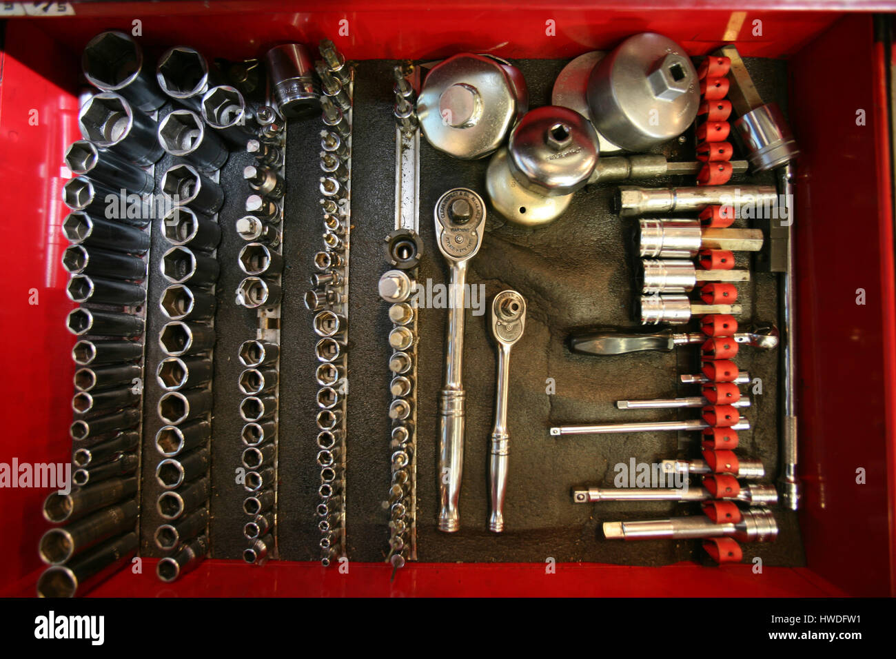 motor mechanic at work, maintaining engines in a workshop Stock Photo ...