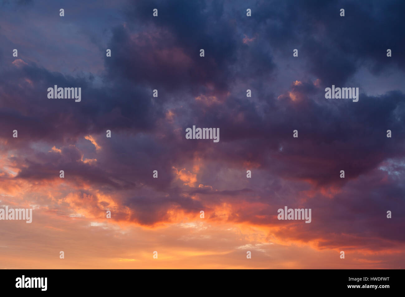 Fiery vivid sunset sky clouds Stock Photo - Alamy