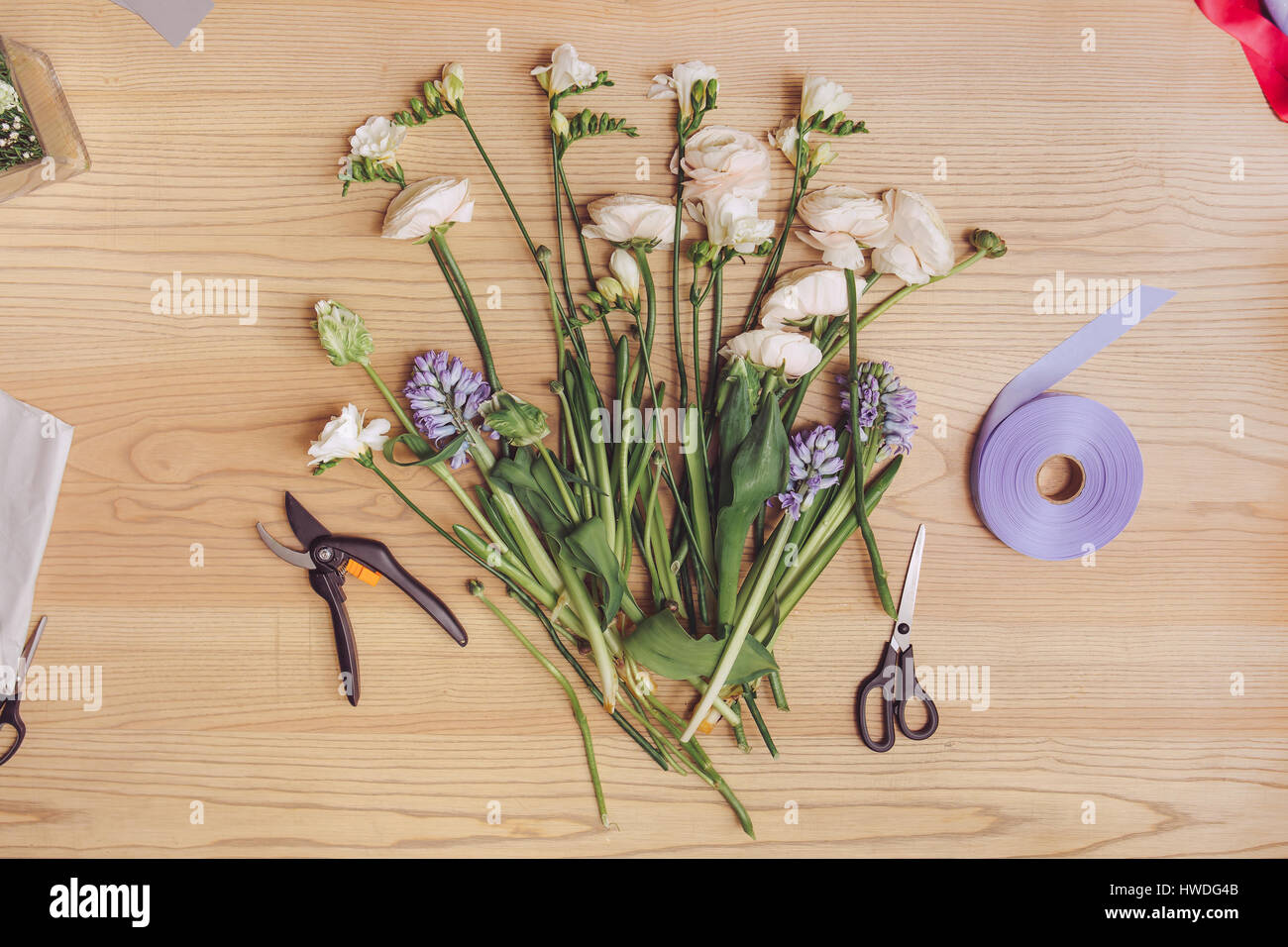 Florist workplace: flowers and accessories Stock Photo - Alamy